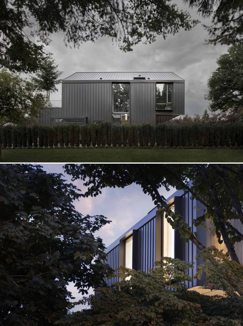 Metal Cladding Wraps Around The Large Gable Roof Of This House