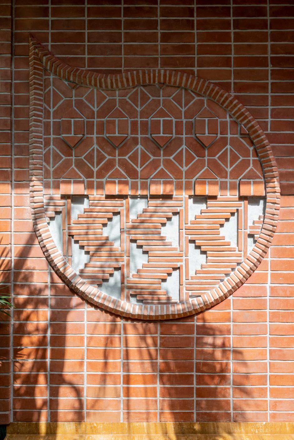 Creative Patterned Designs Cover The Facade Of This Brick House