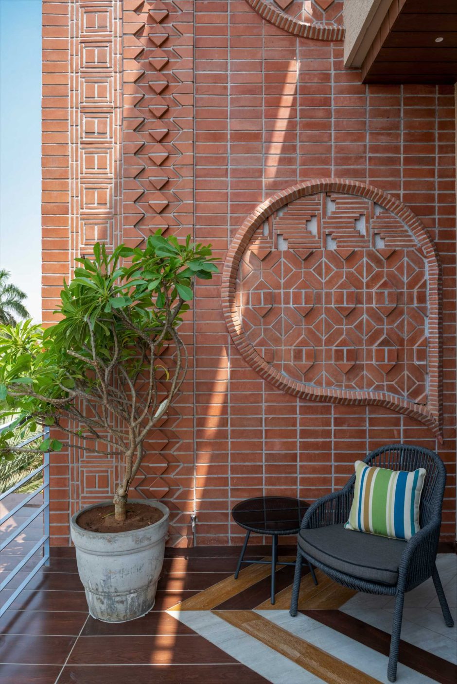 Creative Patterned Designs Cover The Facade Of This Brick House