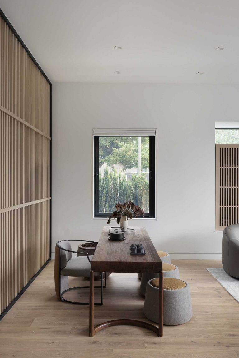 Metal Cladding Wraps Around The Large Gable Roof Of This House