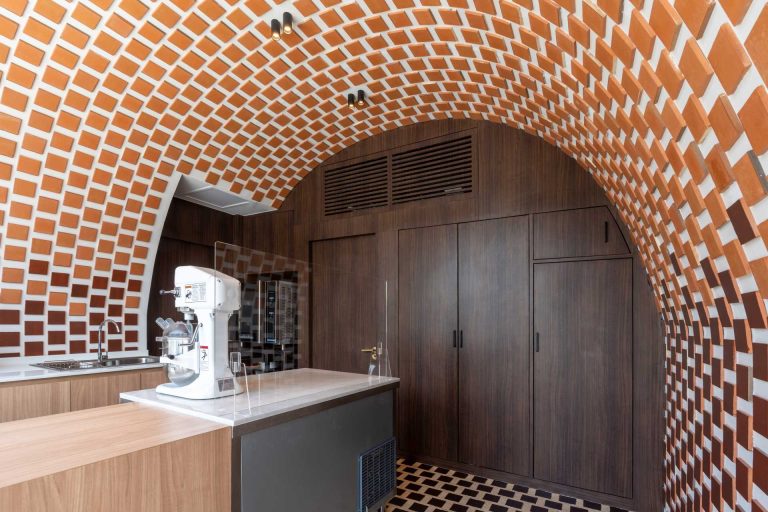 The Large Arch Window In Front Of This Cafe Offers A Glimpse Of The ...