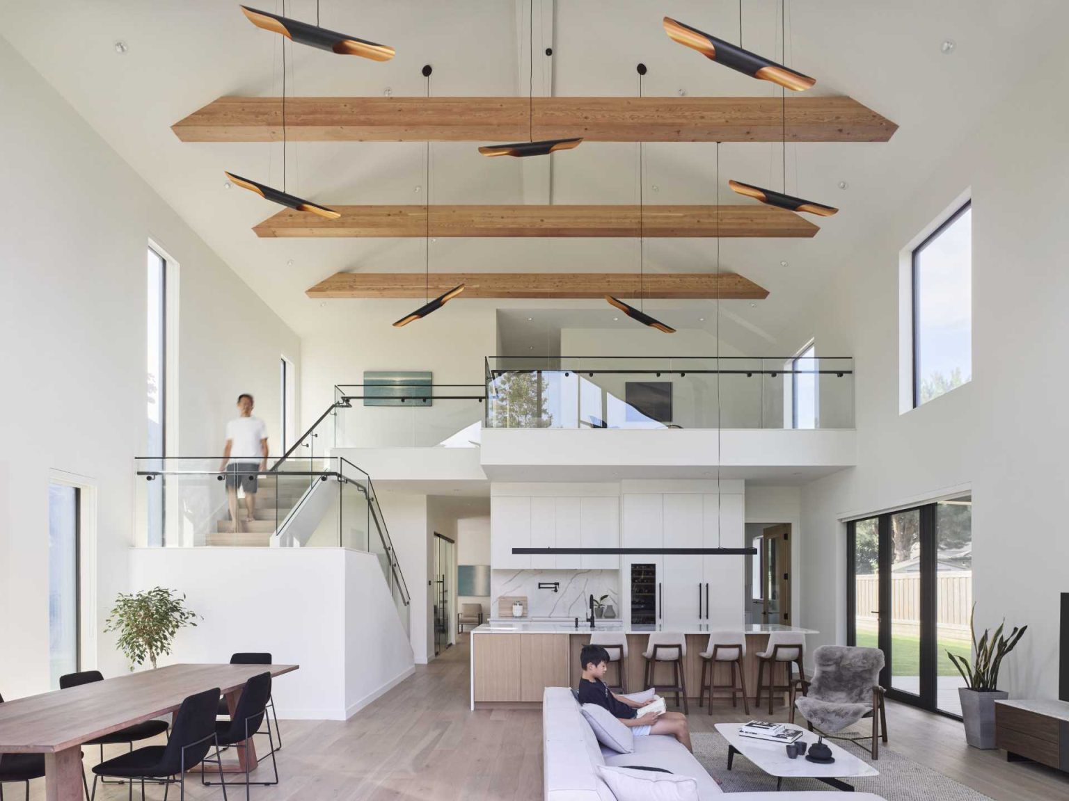A Vaulted Ceiling Is A Dramatic Feature Inside This Modern Barn House