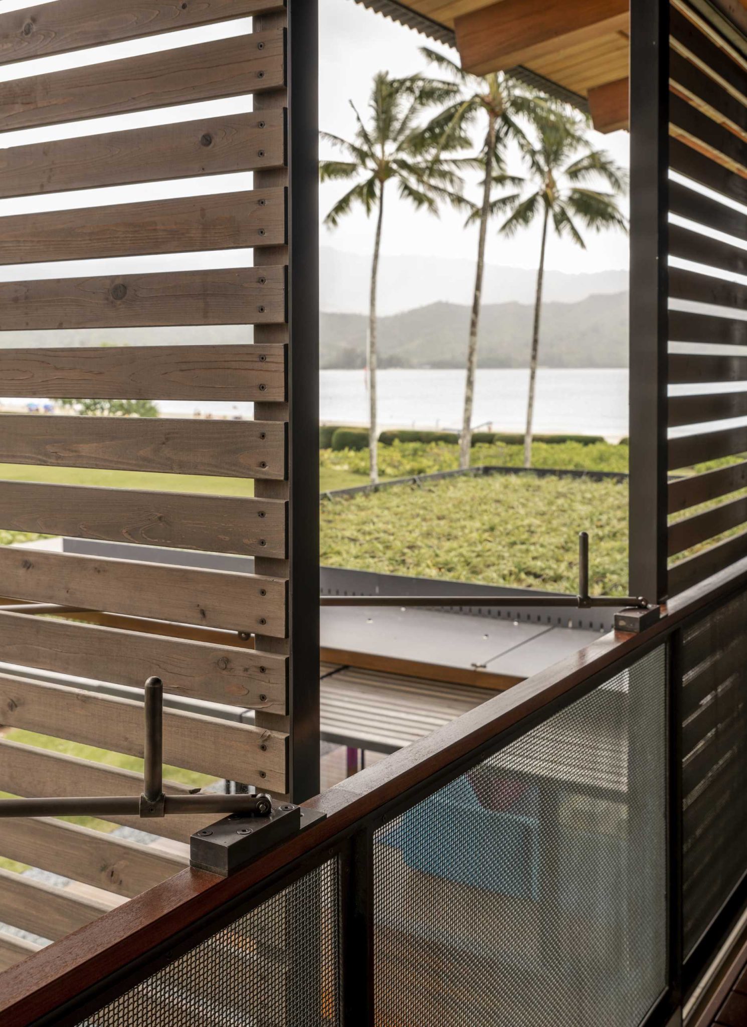 Operable Screens Cover The Exterior Of This Hawaiian Home