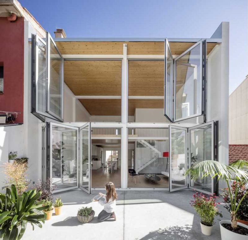 Large Folding Glass Walls Open This Home To A Courtyard