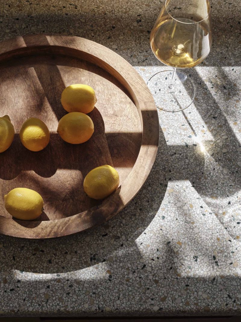 A Seamless Terrazzo Flows From The Wall To The Countertop In This Kitchen