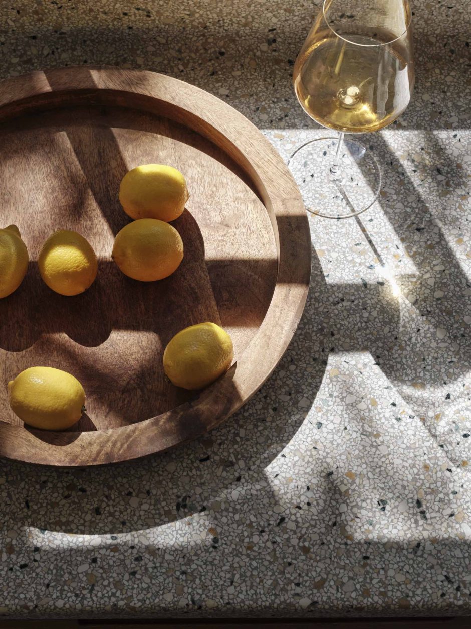 A Seamless Terrazzo Flows From The Wall To The Countertop In This Kitchen