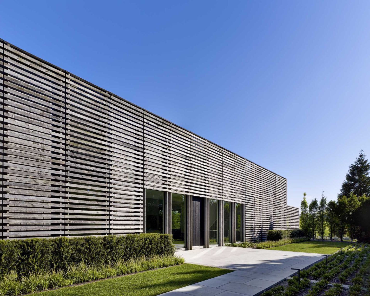 Reclaimed Weathered Wood Siding Covers This Home Inspired By Farm Buildings
