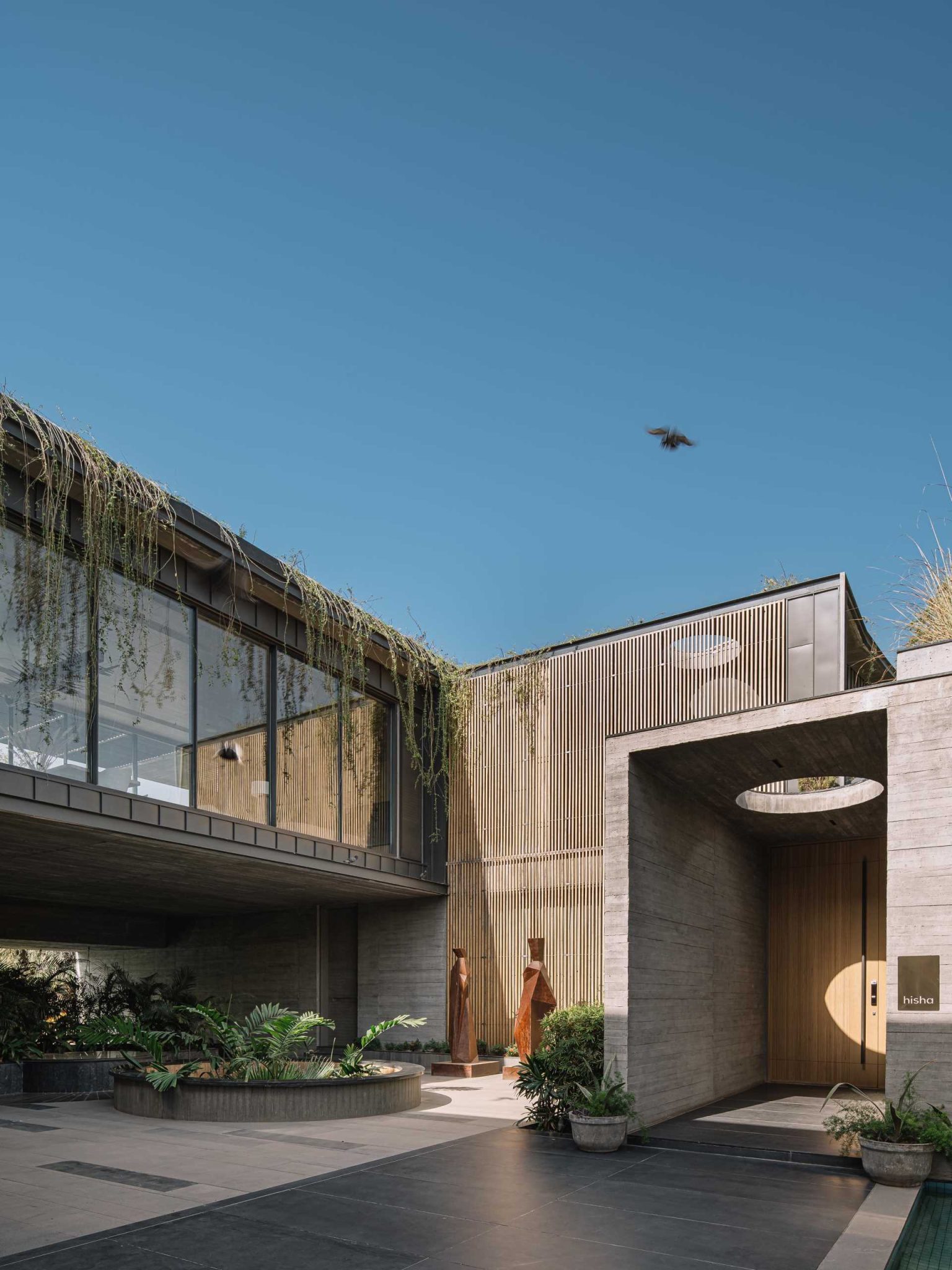 A Curving Bridge Leads To The Entertainment Areas Of This Modern Home
