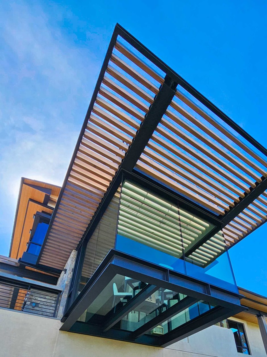 Steel, Wood, And Stone Are On Display Inside This Hillside Home