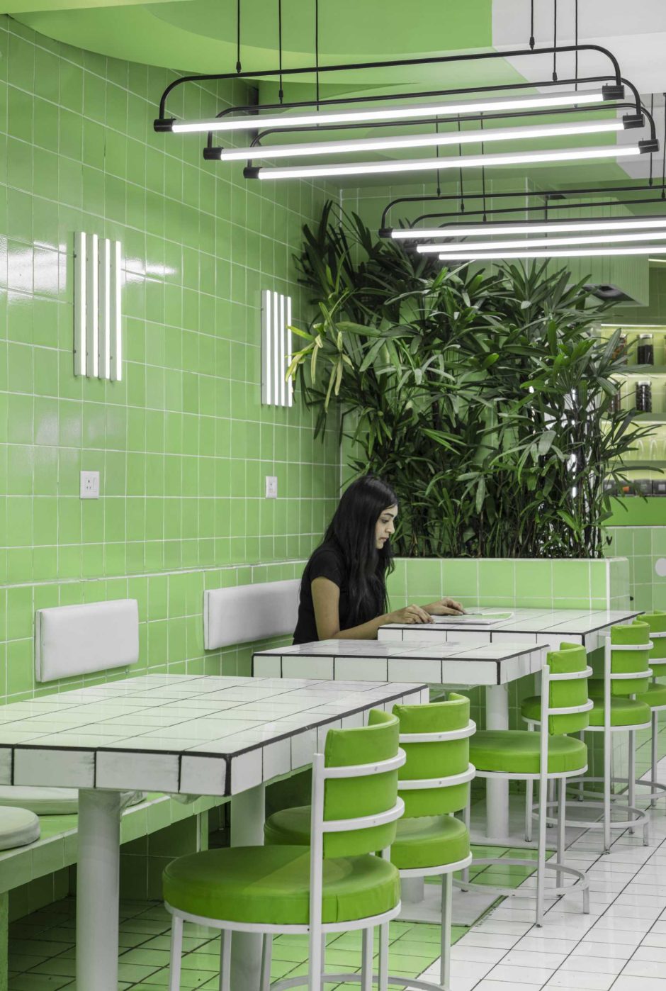 A Green And White Tiled Design Was Created For This Vegan Cafe