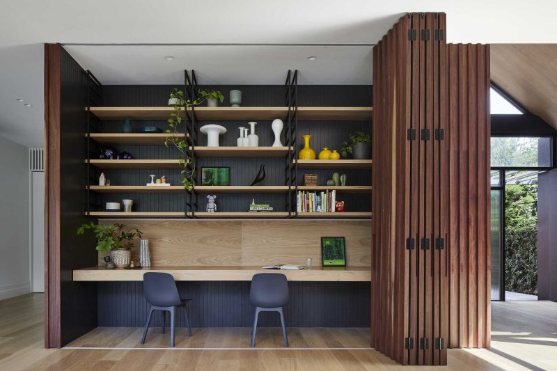 A Home Office Was Hidden Behind A Wall That Folds Open