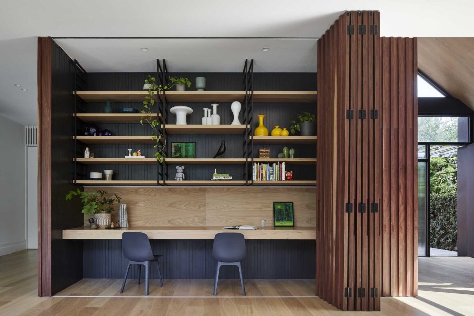 A Home Office Was Hidden Behind A Wall That Folds Open