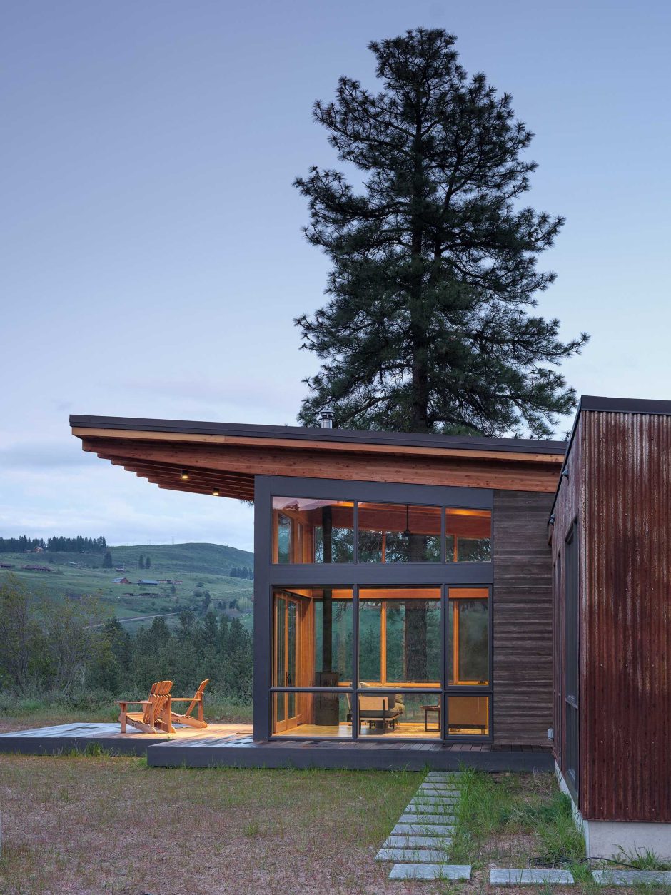 A Dramatic Upward-Sloping Roof Covers This Rural Home