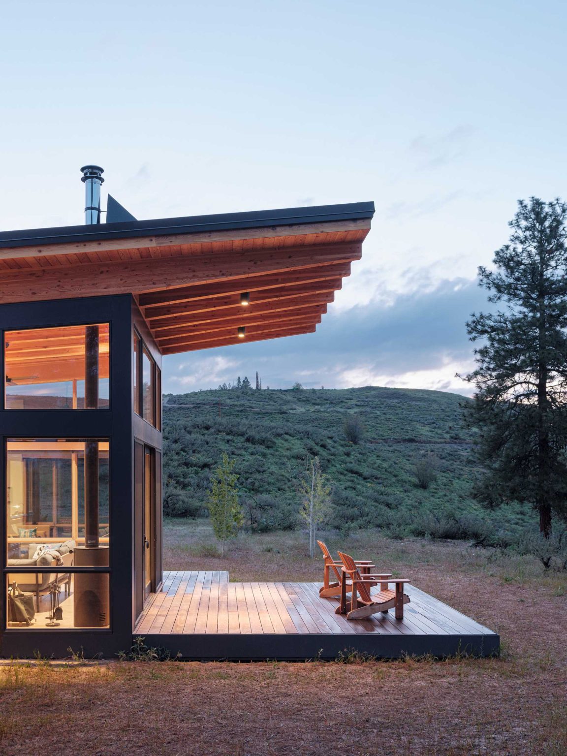 A Dramatic Upward-Sloping Roof Covers This Rural Home