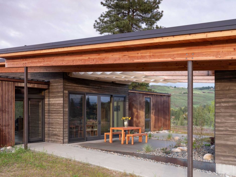 A Dramatic Upward-Sloping Roof Covers This Rural Home