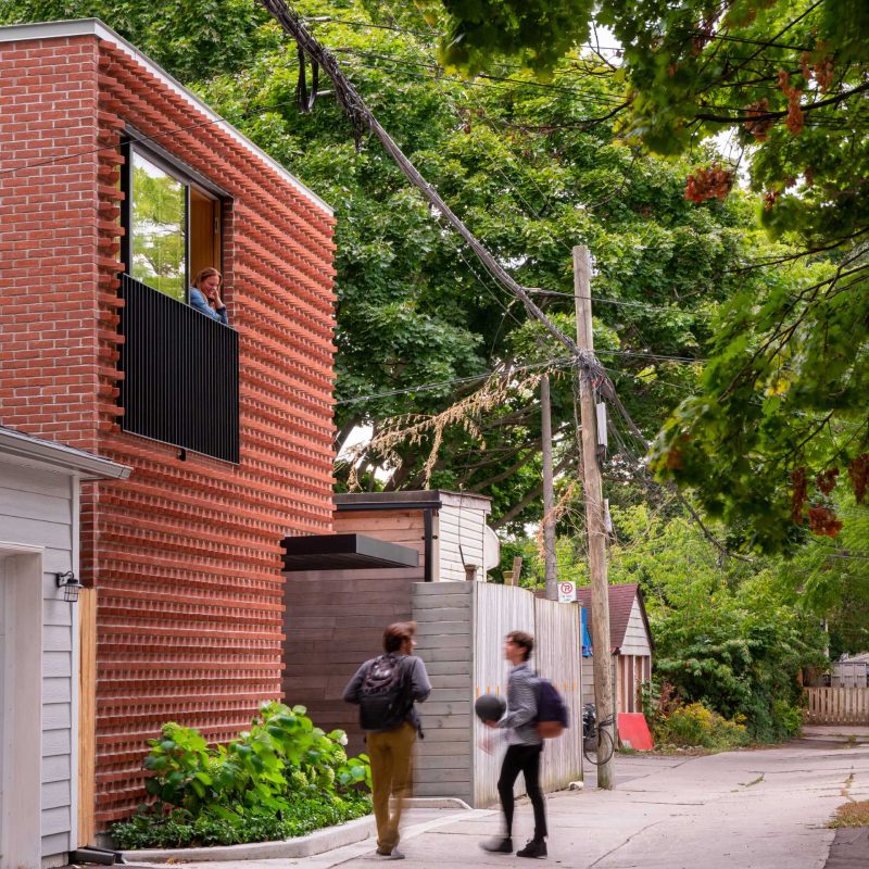 A Laneway House With A Rotated Brick Facade