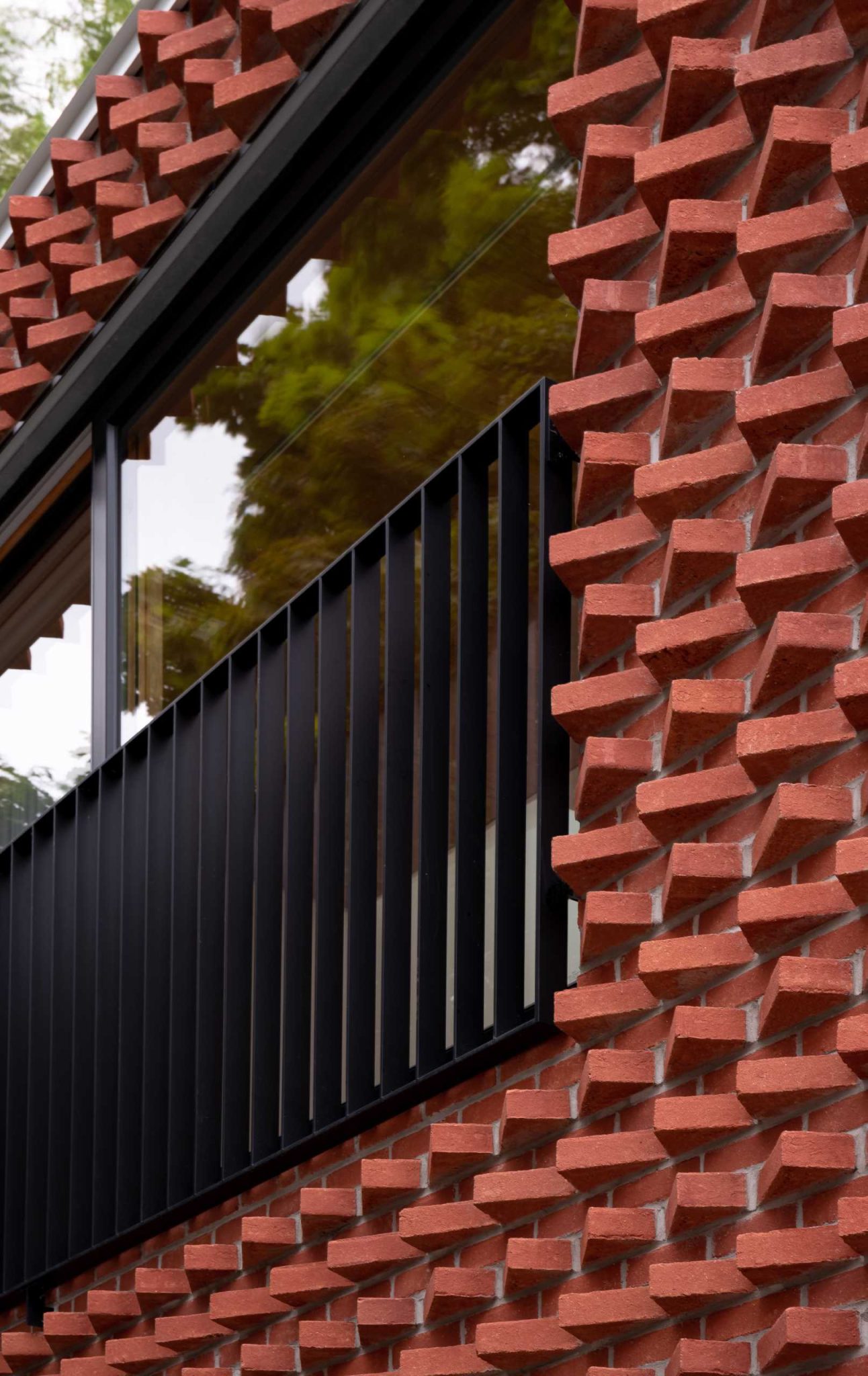 A Laneway House With A Rotated Brick Facade