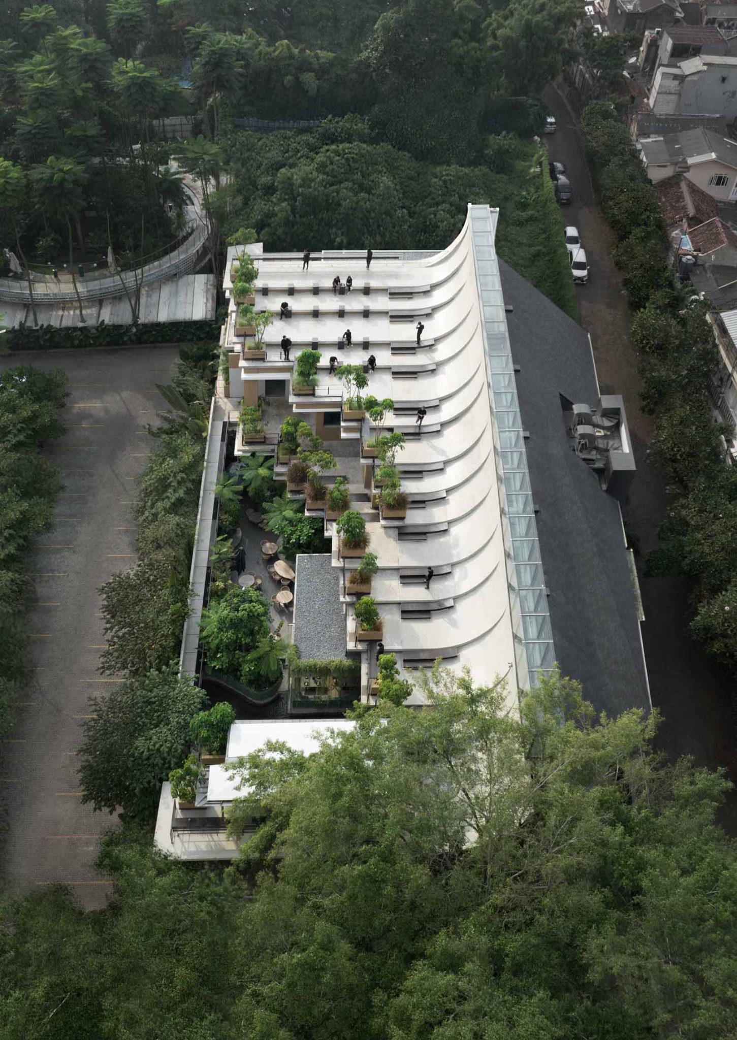 This Building With A Split Roof Makes Space For A Rooftop Park
