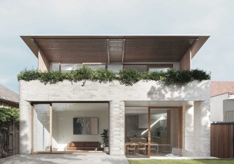 A Material Palette Of Pale Brick, Concrete, And Timber Echoes This Home ...