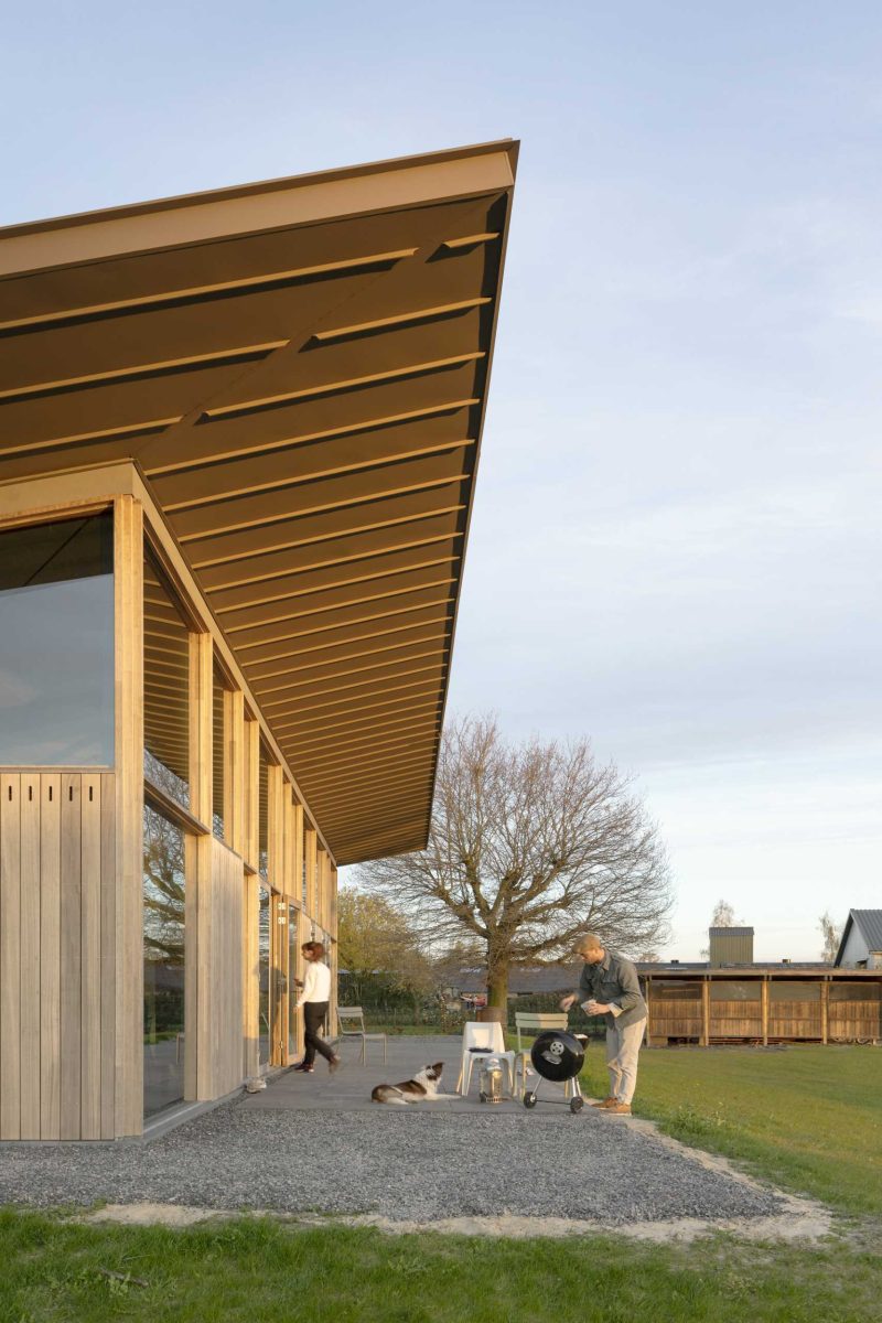 An Extended Sloped Roof Runs The Length Of This Modern Home