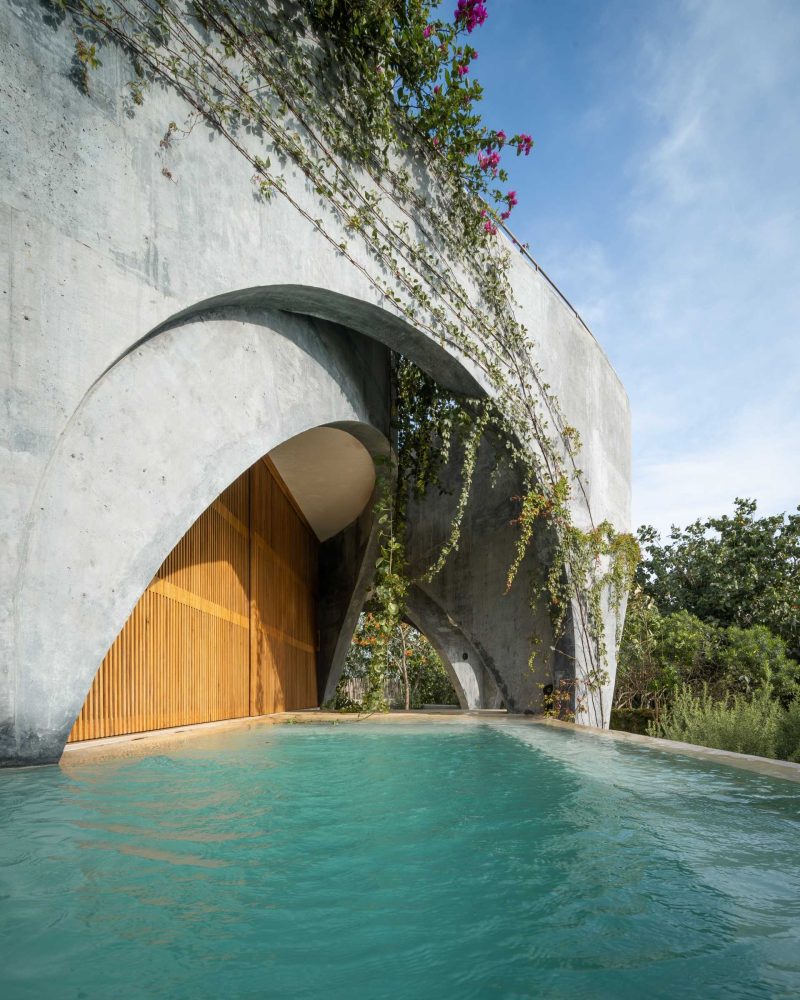 A Round Design And Open Arches Give This Concrete Home A Unique Look
