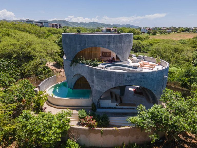 A Round Design And Open Arches Give This Concrete Home A Unique Look