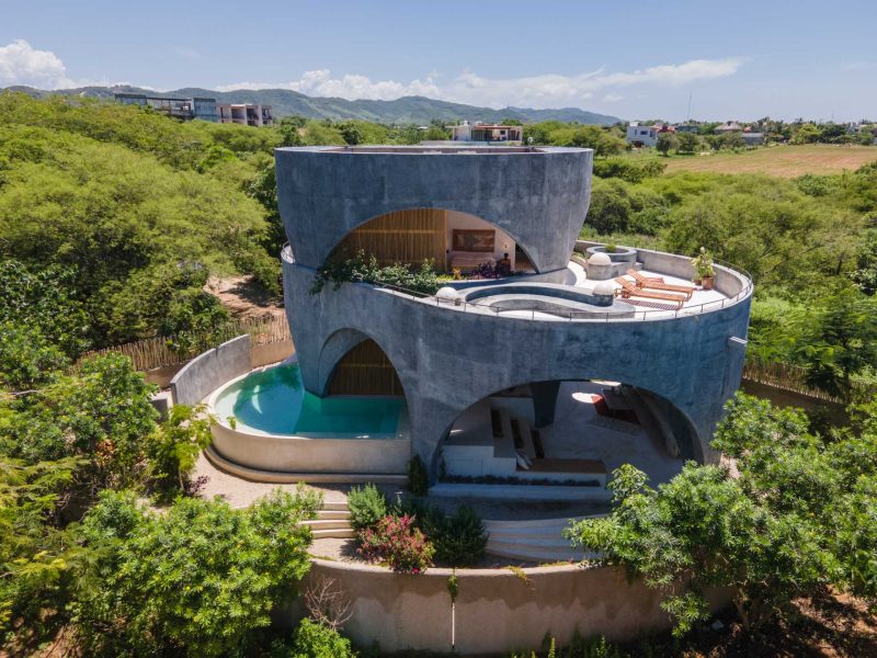 A Round Design And Open Arches Give This Concrete Home A Unique Look