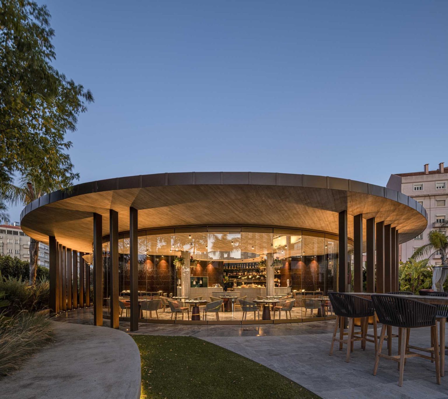 A Concrete Ceiling Floats Above This Round Hotel Bar