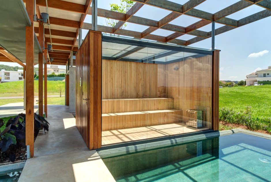 An Exposed Structure Shows Off This House Design That Wraps Around A Pool