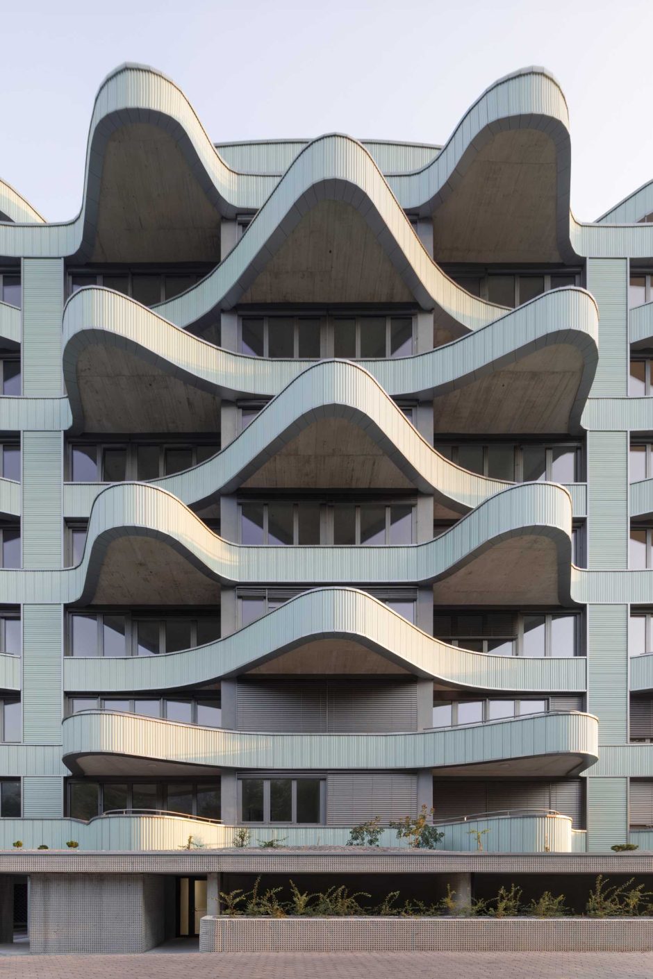 Undulating Balconies And A Mint Green Tiled Exterior Give This New ...