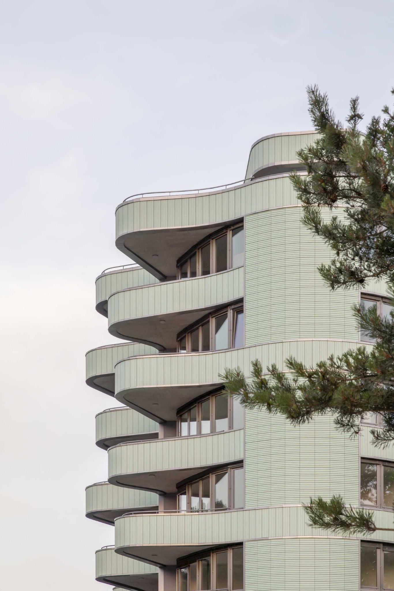 Undulating Balconies And A Mint Green Tiled Exterior Give This New ...