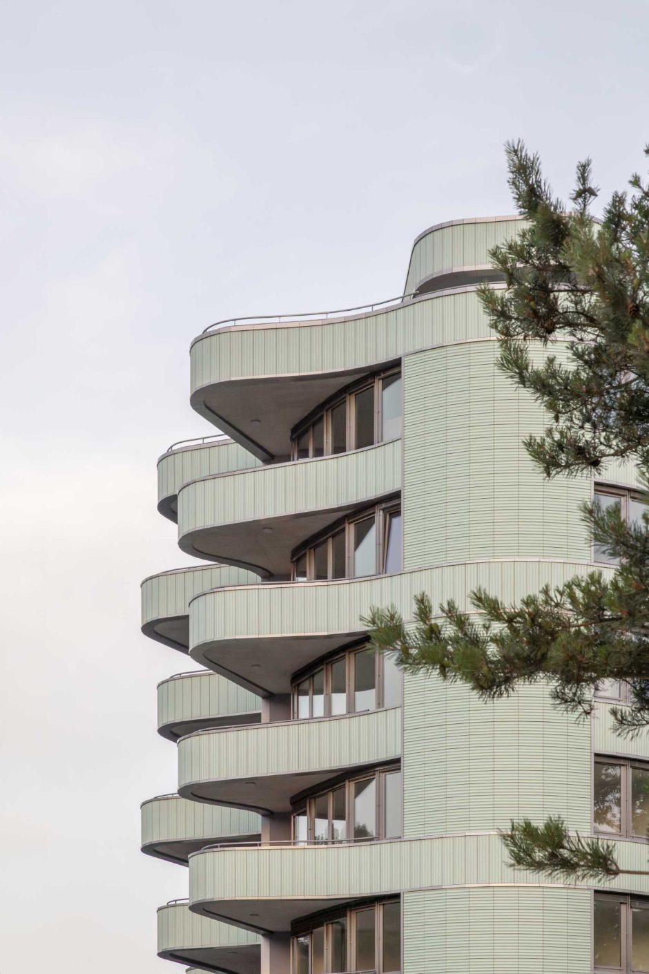 Undulating Balconies And A Mint Green Tiled Exterior Give This New ...