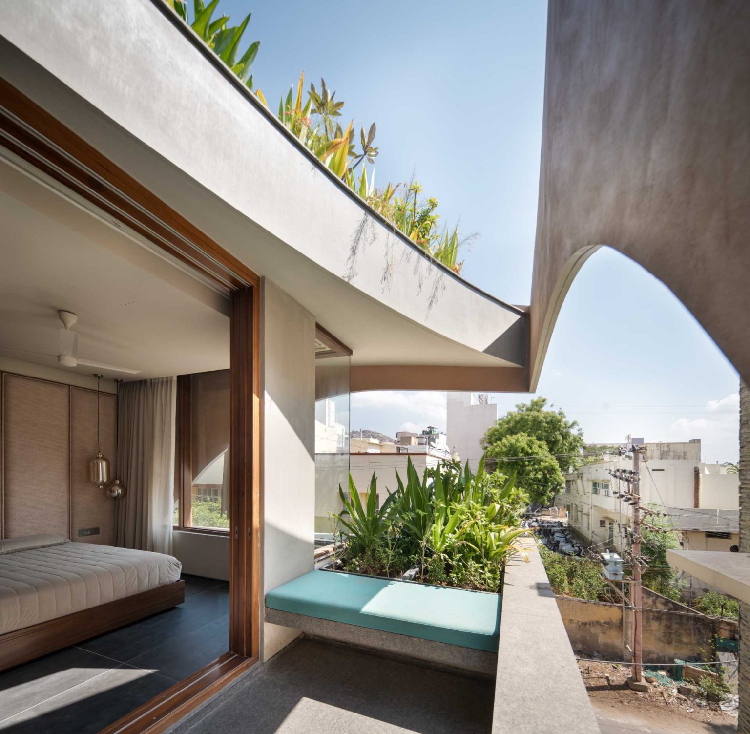 A Curvy Concrete Cube With Cut Outs For Windows Is The Form Of This New ...