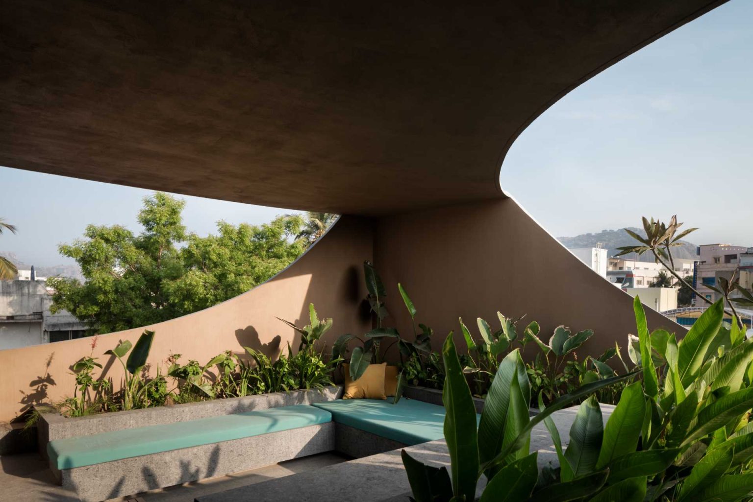 A Curvy Concrete Cube With Cut Outs For Windows Is The Form Of This New ...