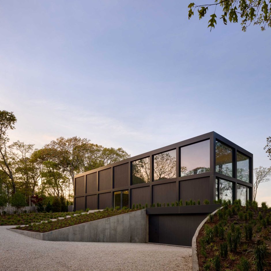 A Grid Of Large Windows Maximizes The Water Views At This Modern Home