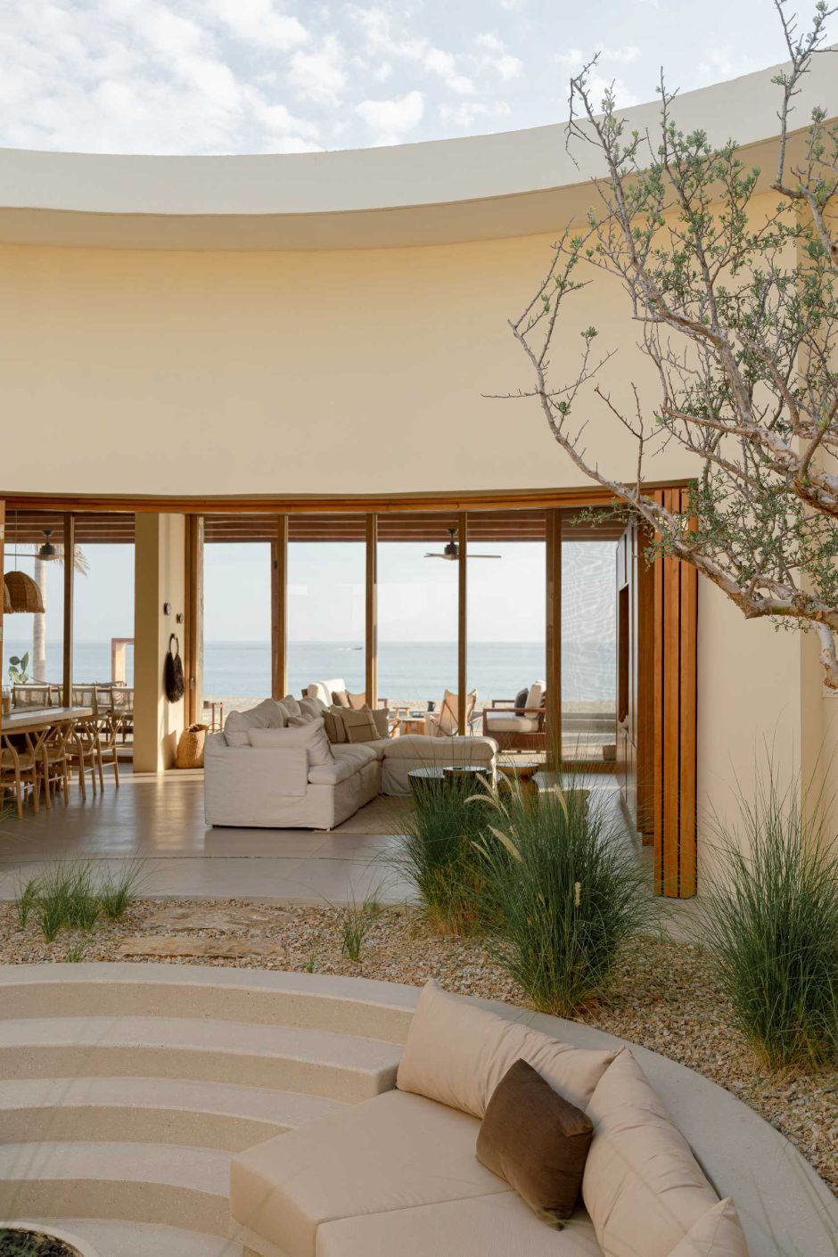 A Stone Covered Home That Surrounds A Central Courtyard With Sunken ...