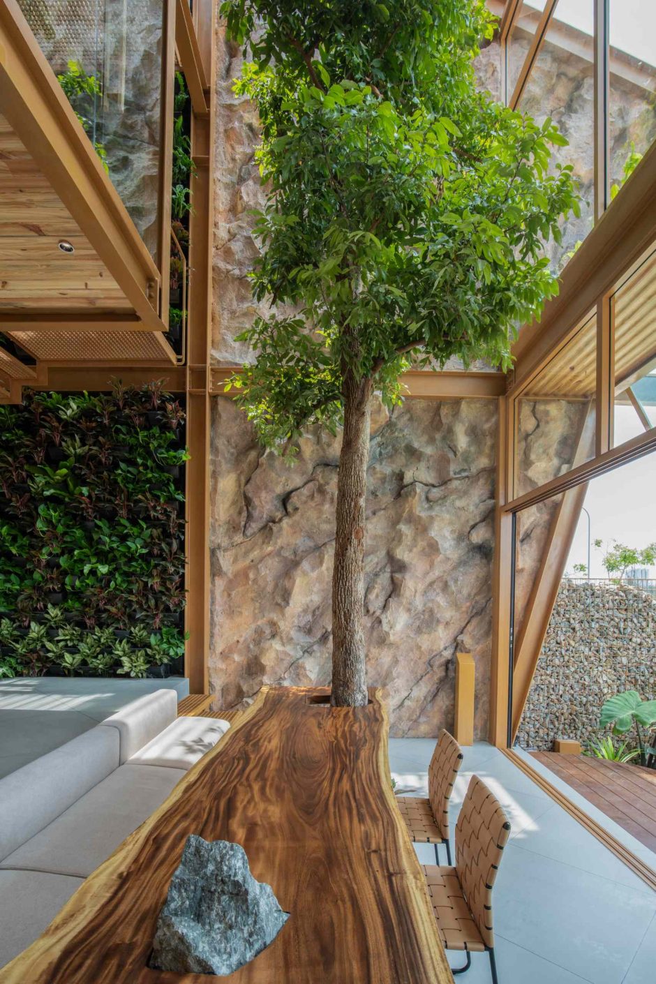 This house collects rainwater, grows trees indoors, and runs on solar power
