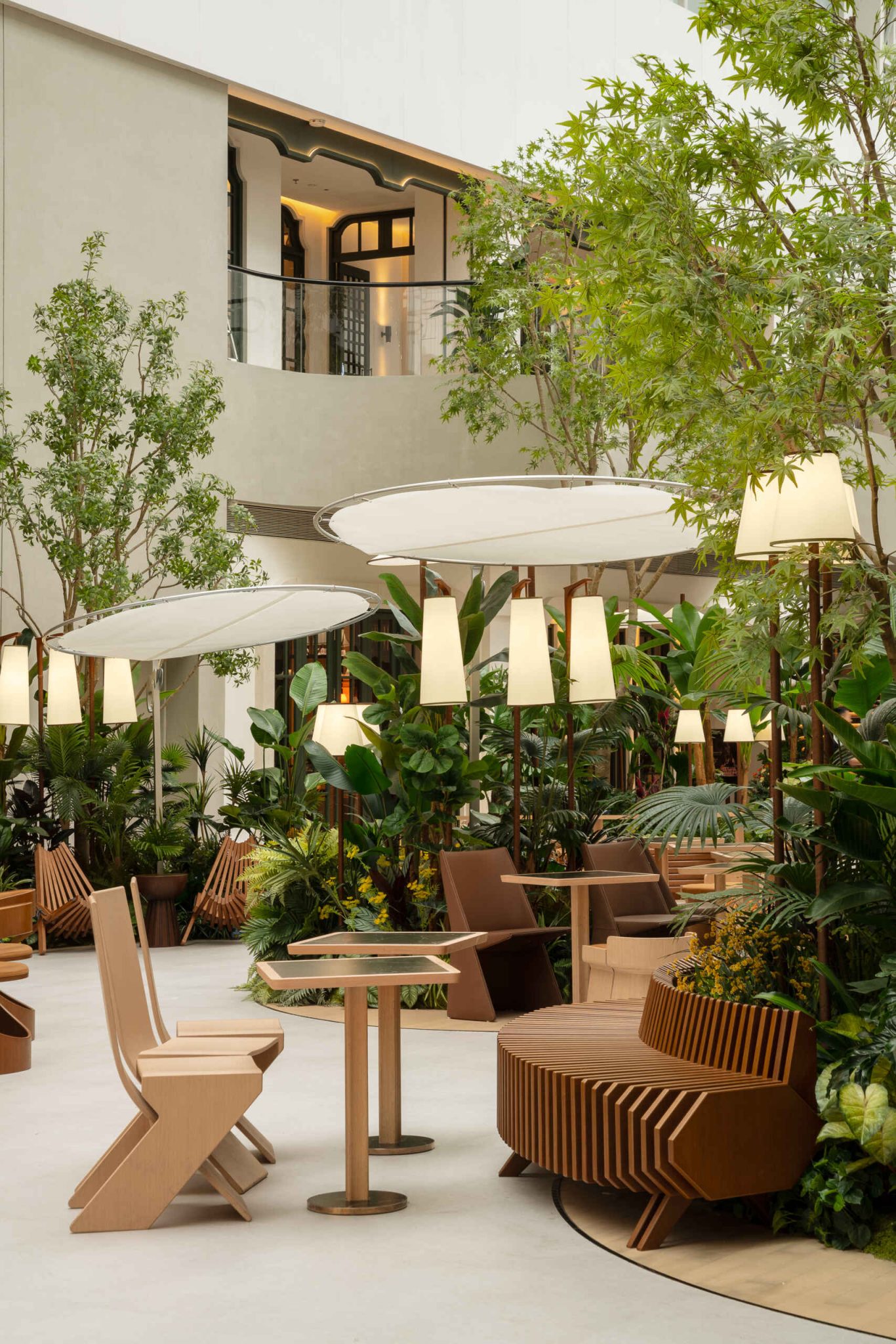 the lighting within the space blends seamlessly into the garden