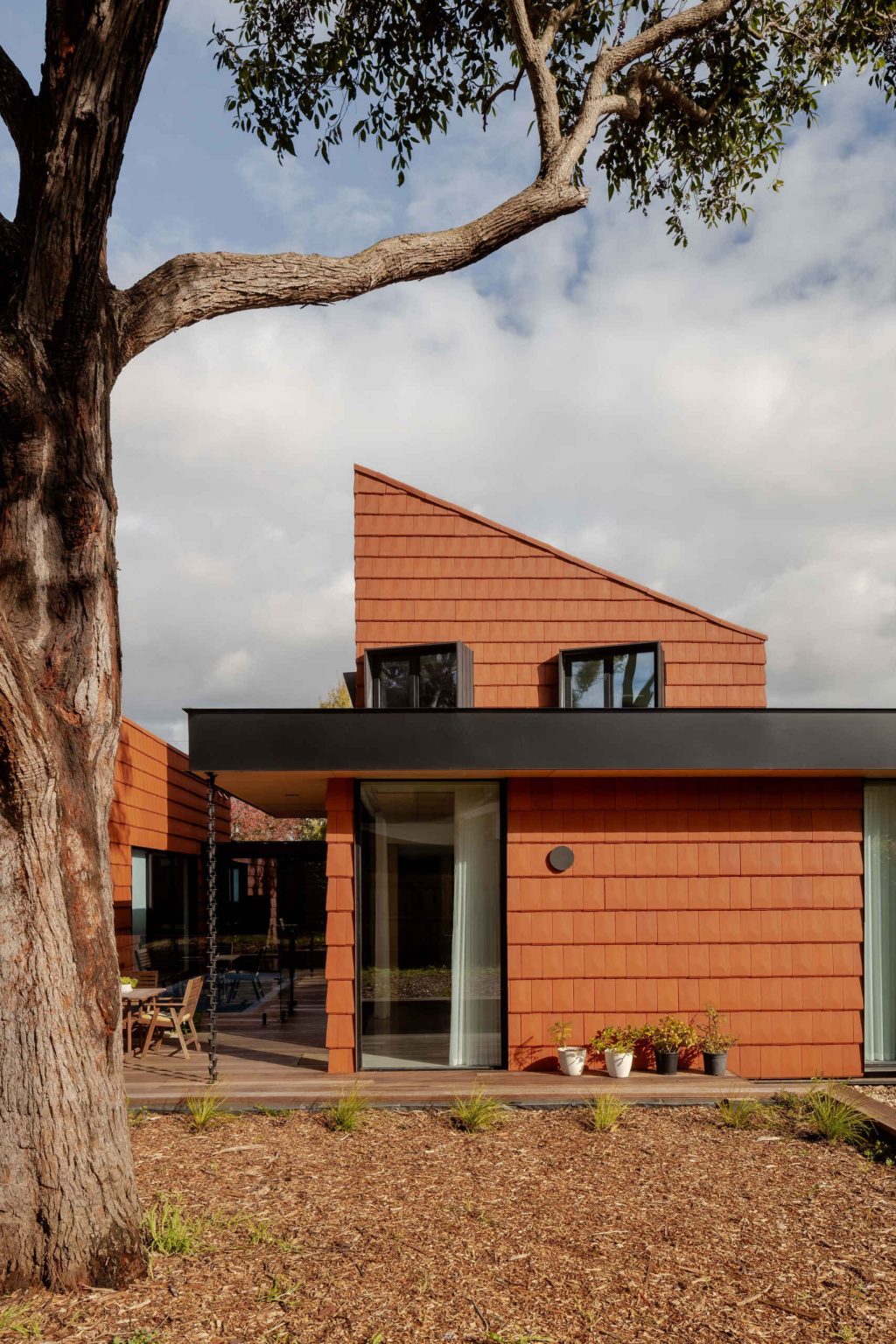 How Terracotta Shingles Bring Earthy Warmth To This Modern Home