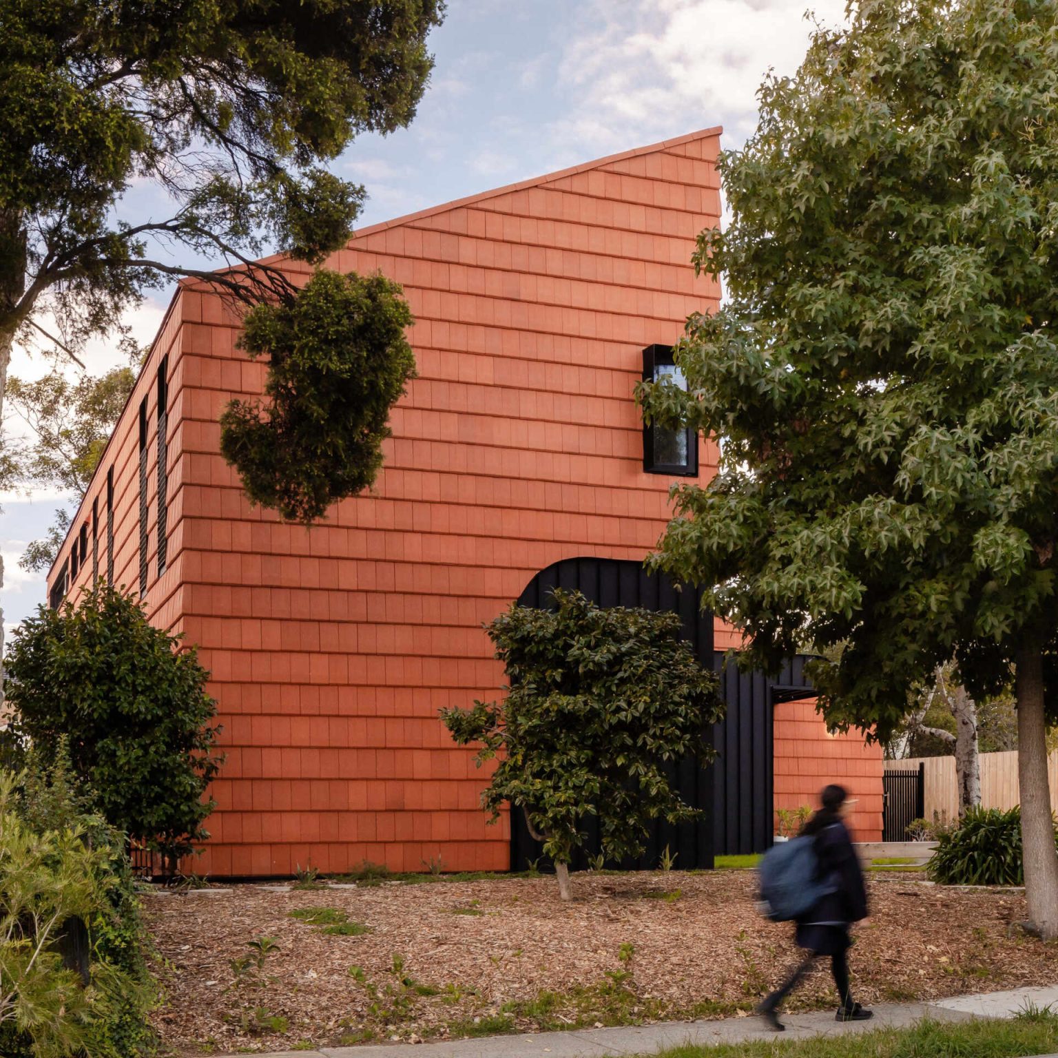How Terracotta Shingles Bring Earthy Warmth To This Modern Home
