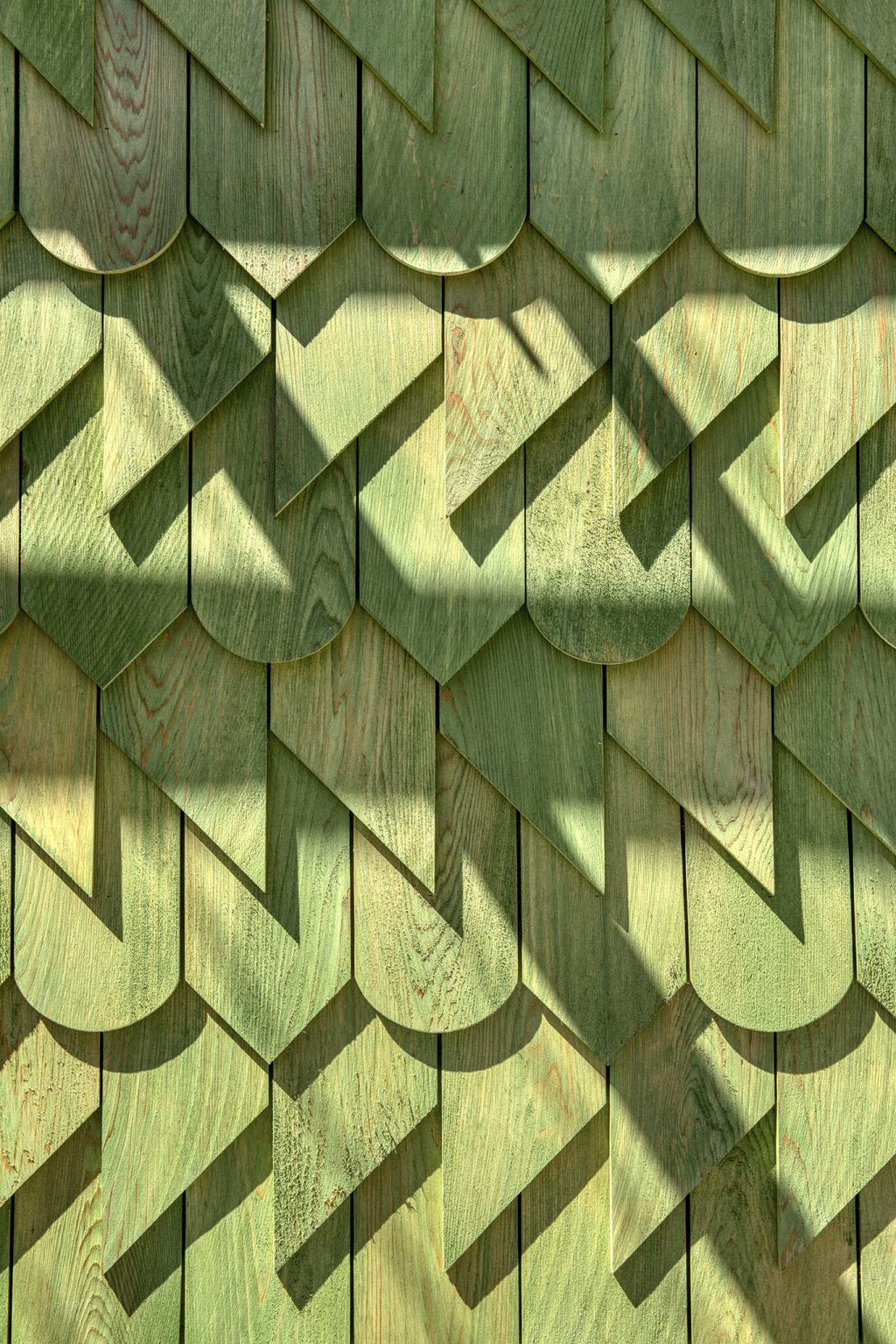 Dragon-Inspired Wood Shingles Cover This Laneway Garage