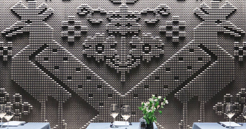 The Story Behind Olivo’s Striking Stone Tapestry Walls