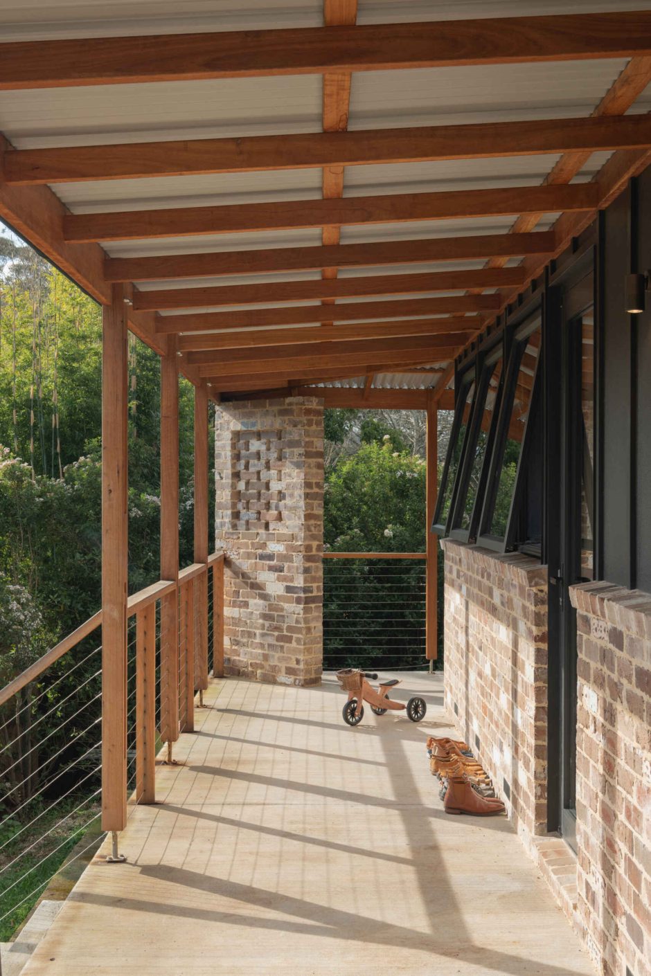 Inside the wraparound porch home glowing at golden hour