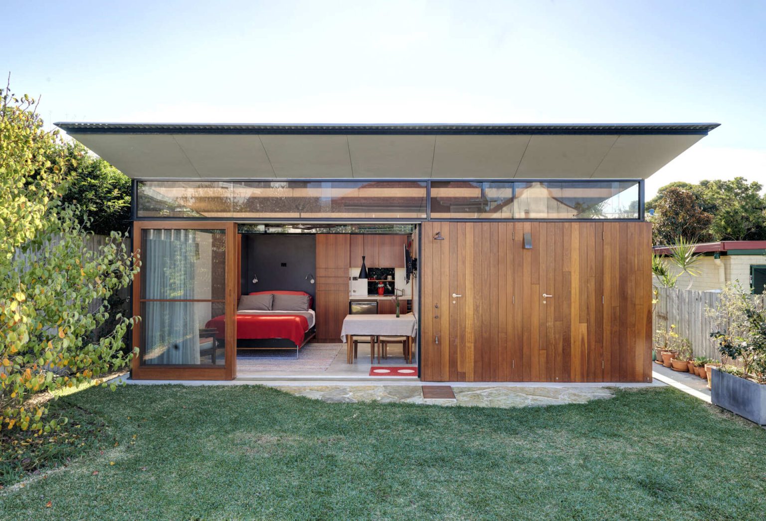 Take a Look at a Small Backyard Studio with a Living Space, Bathroom ...