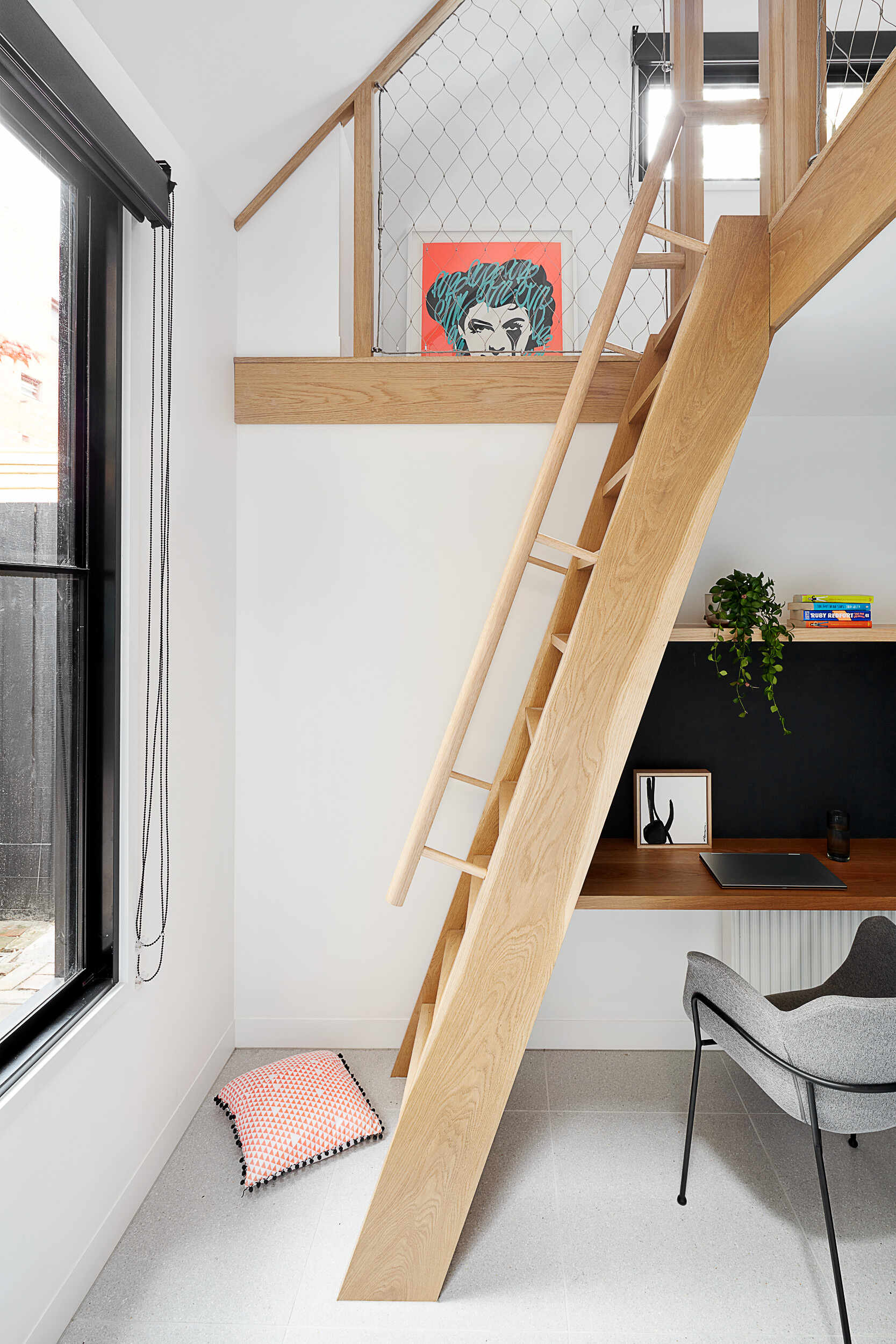 A Bookshelf Wall, a Courtyard and a Surprise Loft Transform this Home