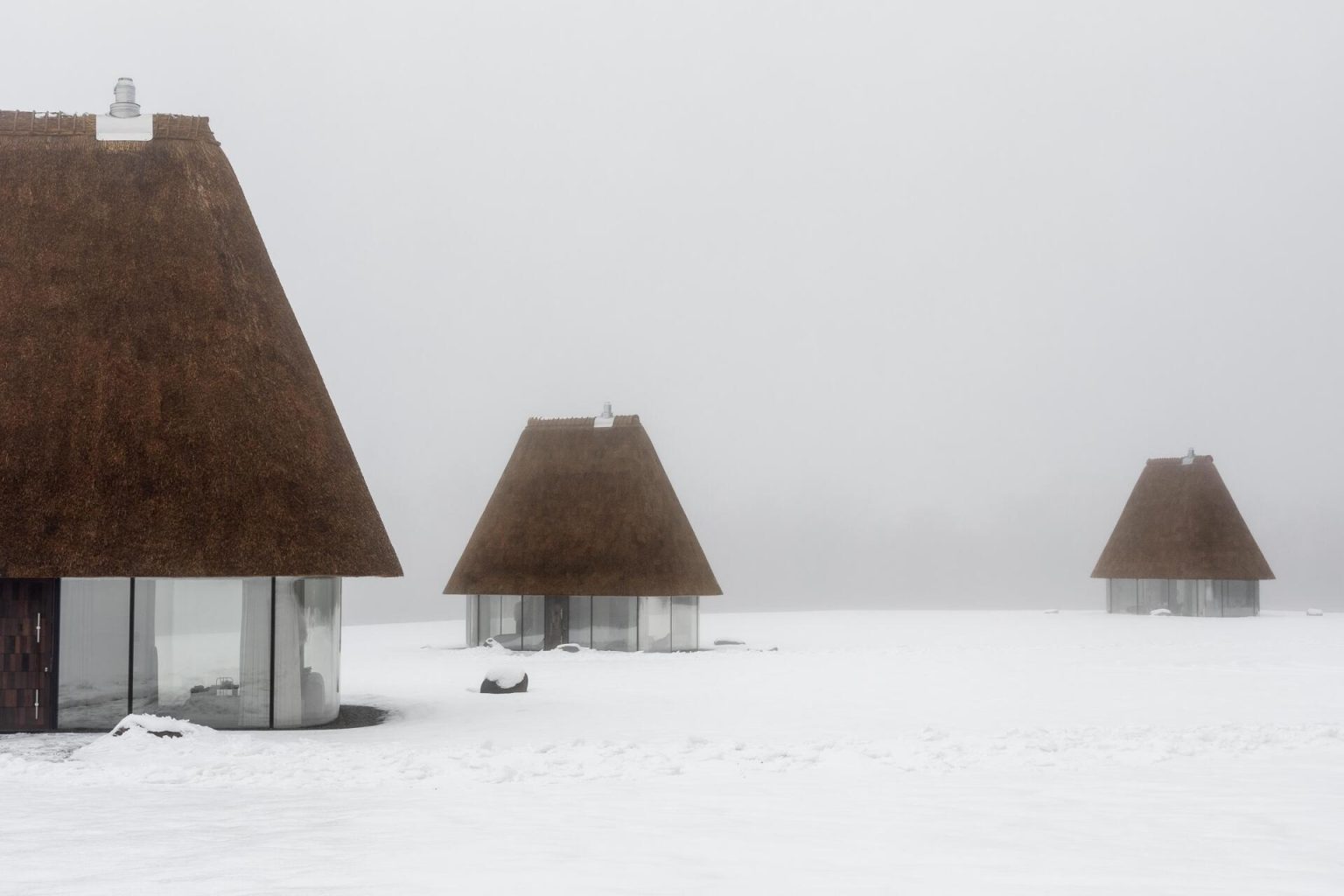 These Glass Guesthouses Turn a Traditional Thatched Roof Into a ...